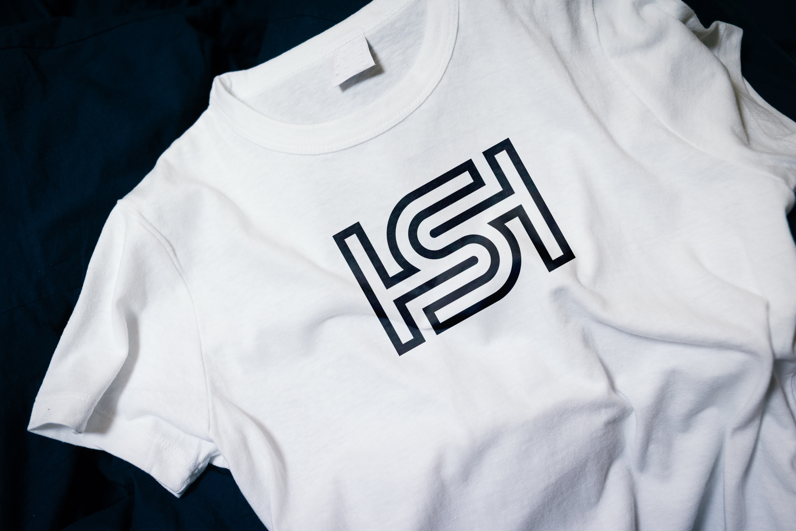 SH or HS logo on tshirt mockup by Rasagama on Dribbble