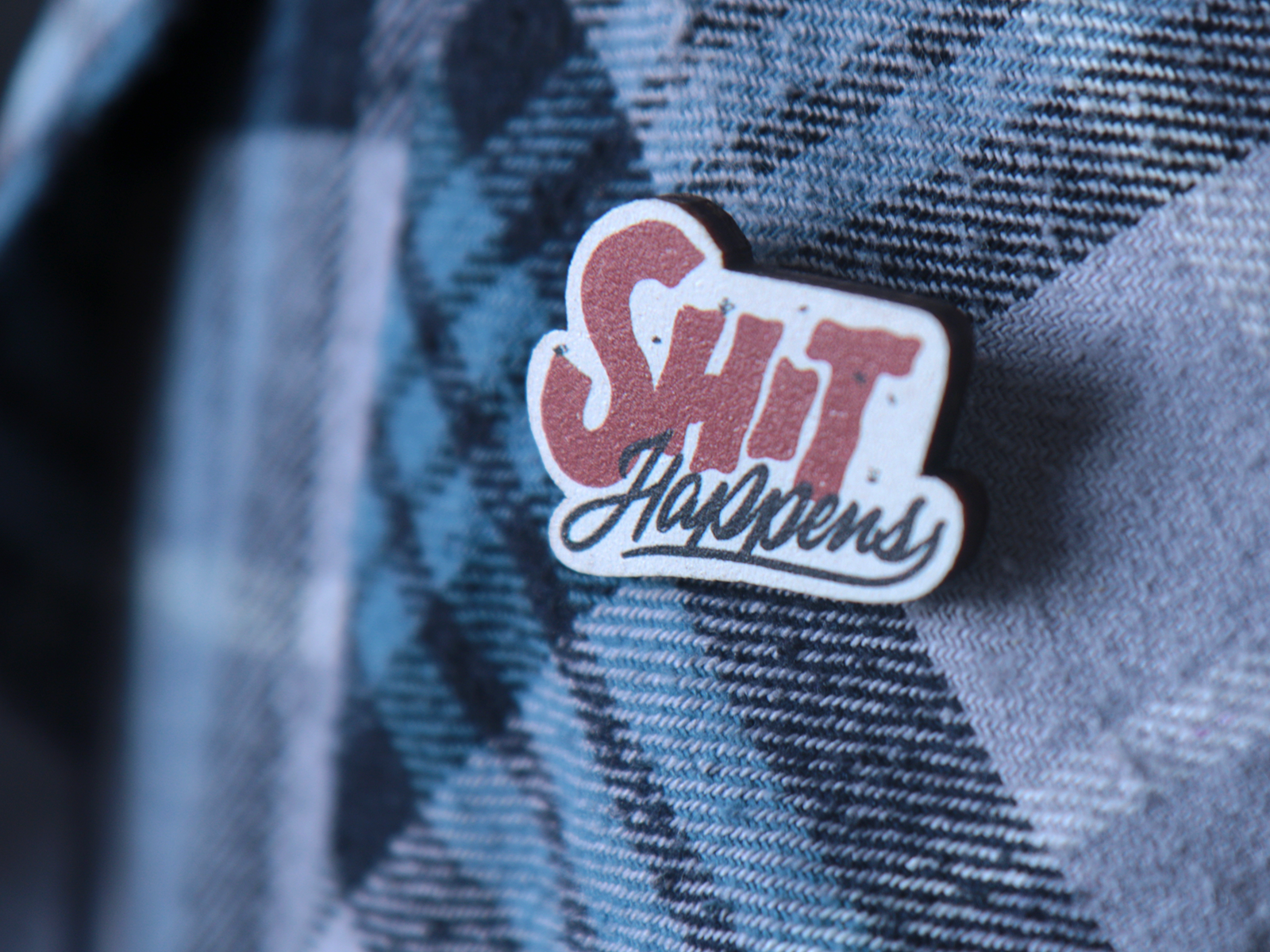 Shit happens – wooden pin by Nikita Bauer on Dribbble